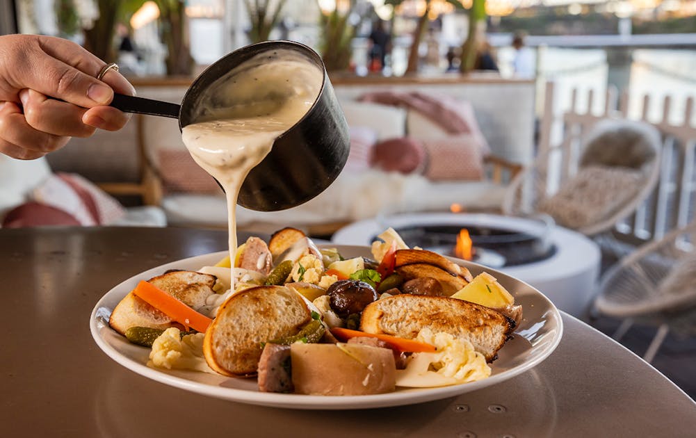 This Riverside Bar Is Dishing Up Beery Fondue And DIY S'mores For ...